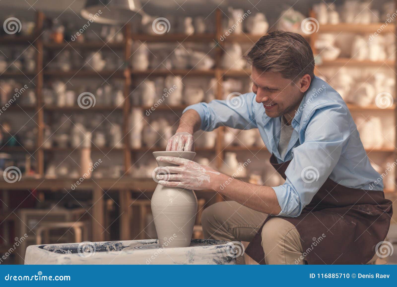 Smiling Young Master in Uniform at Work Stock Photo - Image of making ...