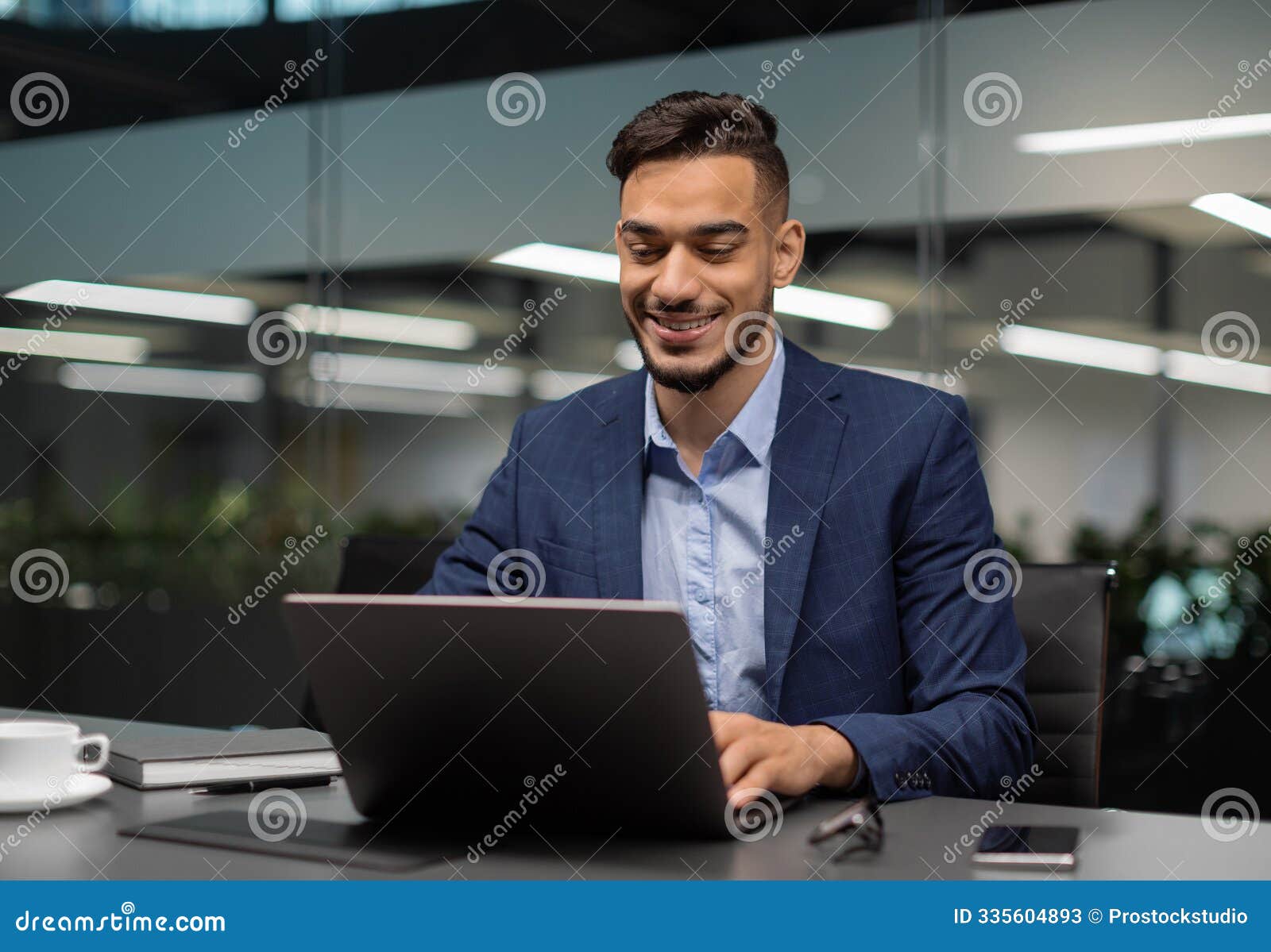 Smiling Middle Eastern Businessman Typing on Computer at Office Stock ...