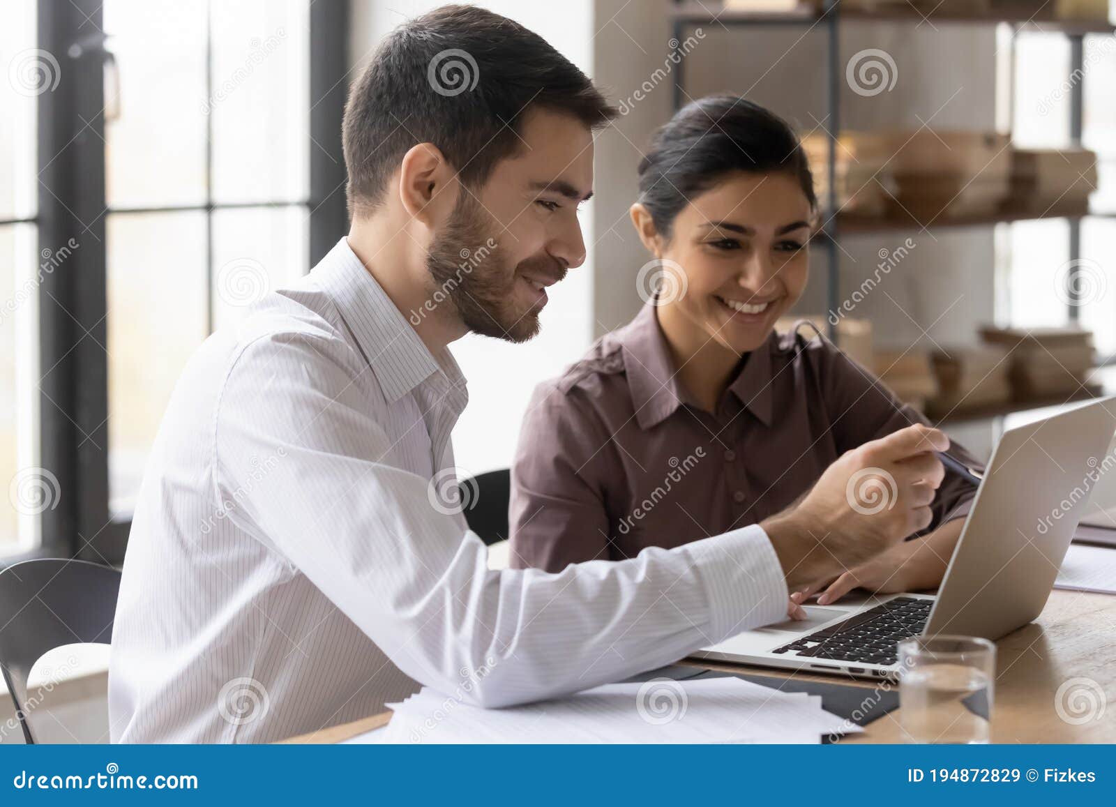 Smiling Young Mixed Race Managers Working on Online Project. Stock ...