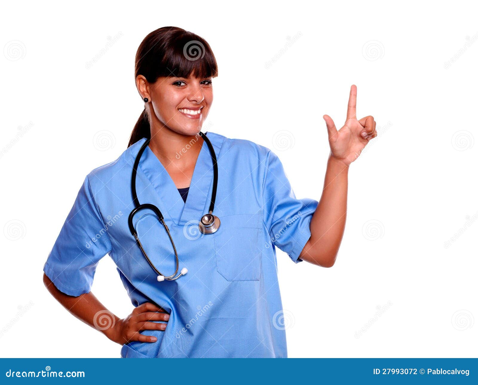 Smiling Young Nurse Looking at You Pointing Up Stock Photo - Image of ...