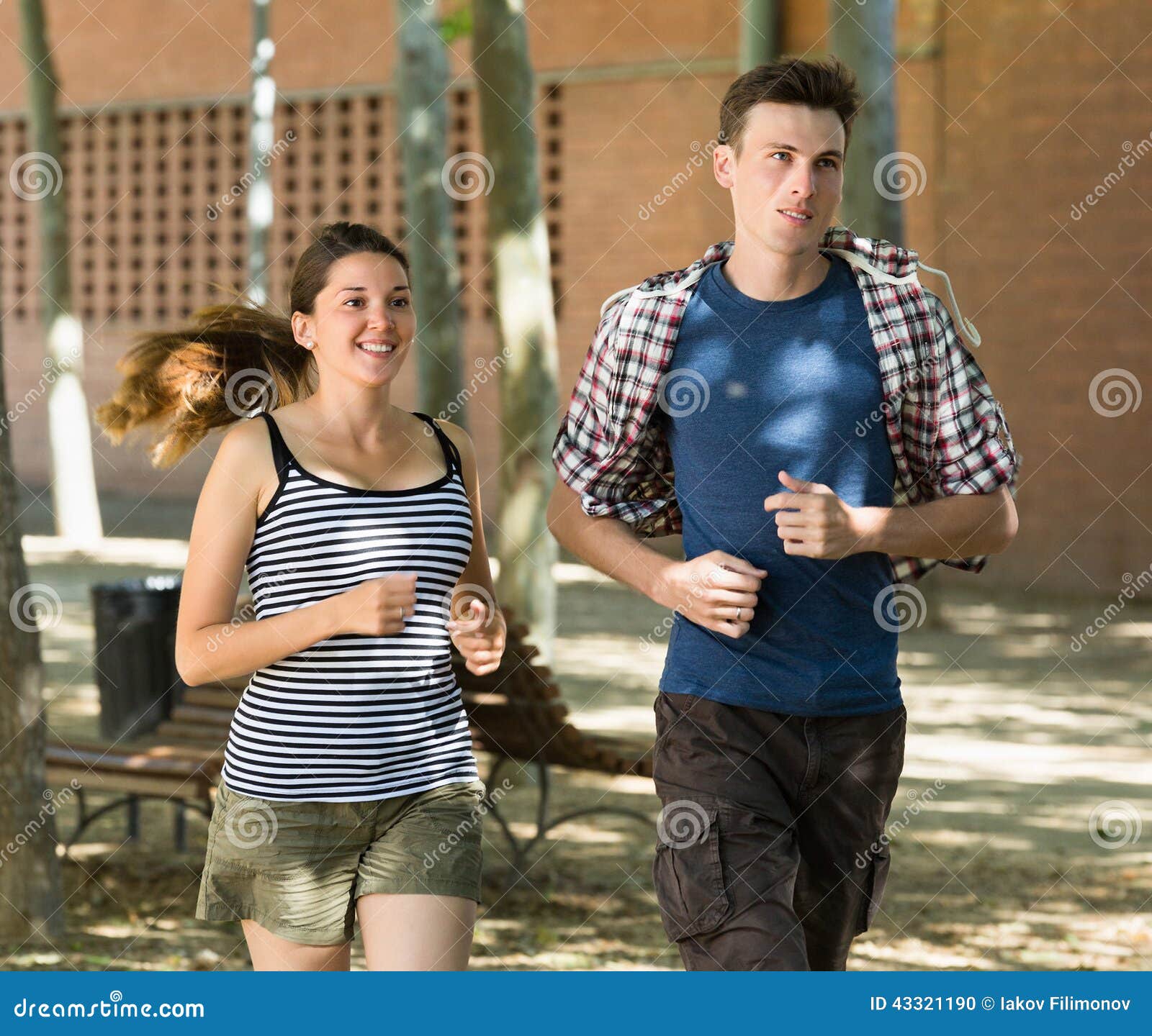Smiling Young People Running Outdoor Stock Photo - Image of city ...
