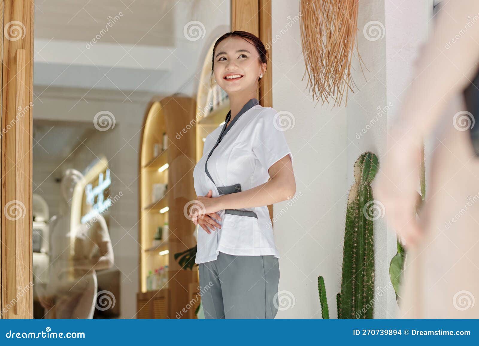 Receptionist Welcoming Client Stock Photo - Image of women, worker ...