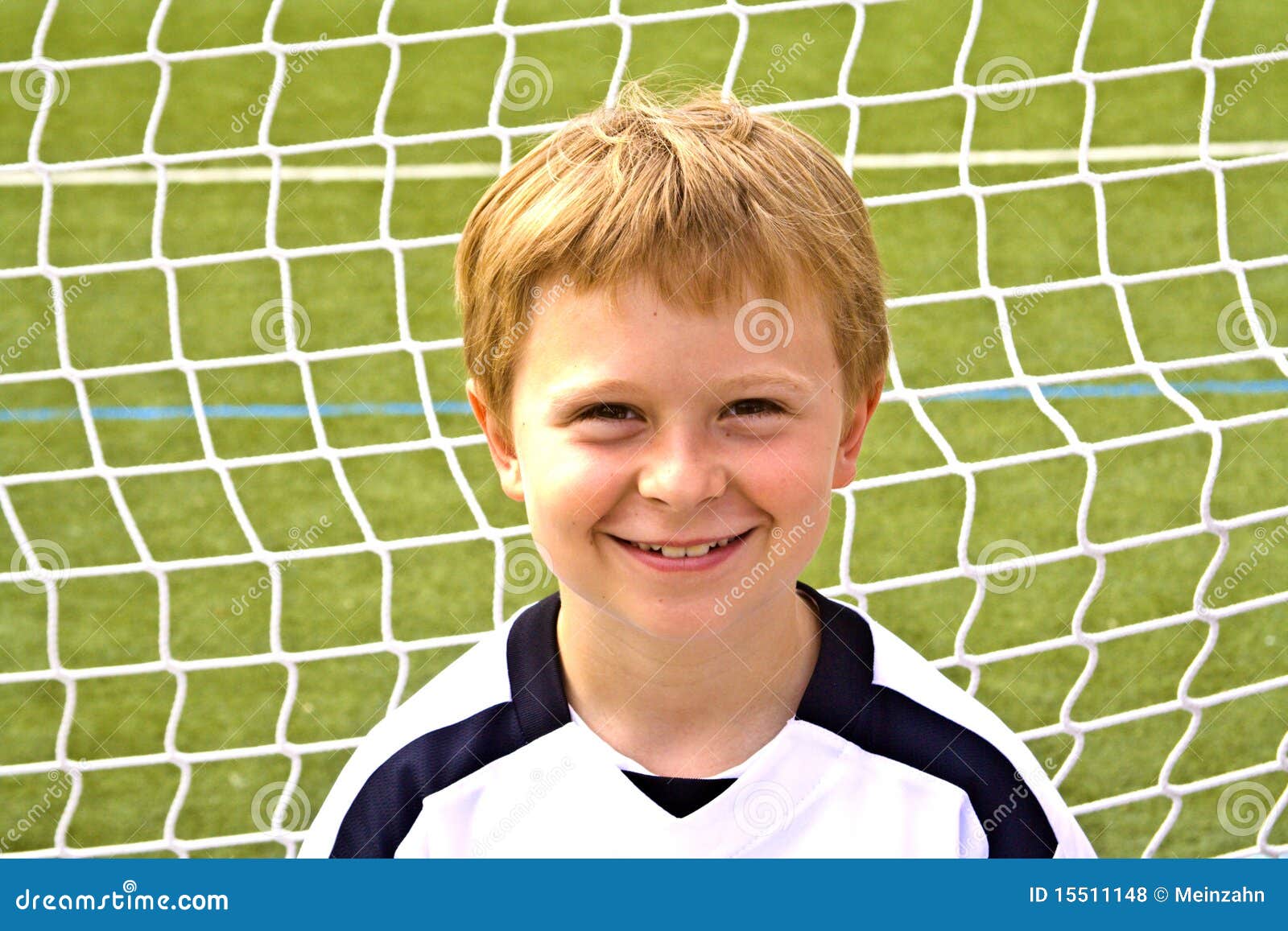 Smiling Young Soccer Player Stock Photo - Image of blue, childhood ...