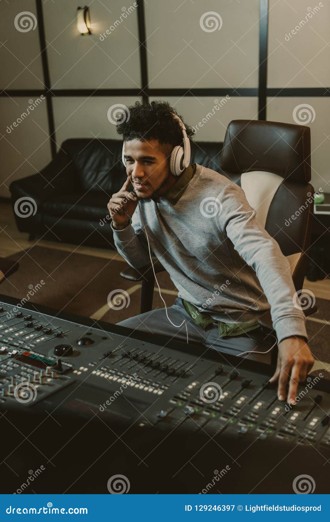 Smiling Young Sound Producer Sitting Stock Image - Image of musician ...