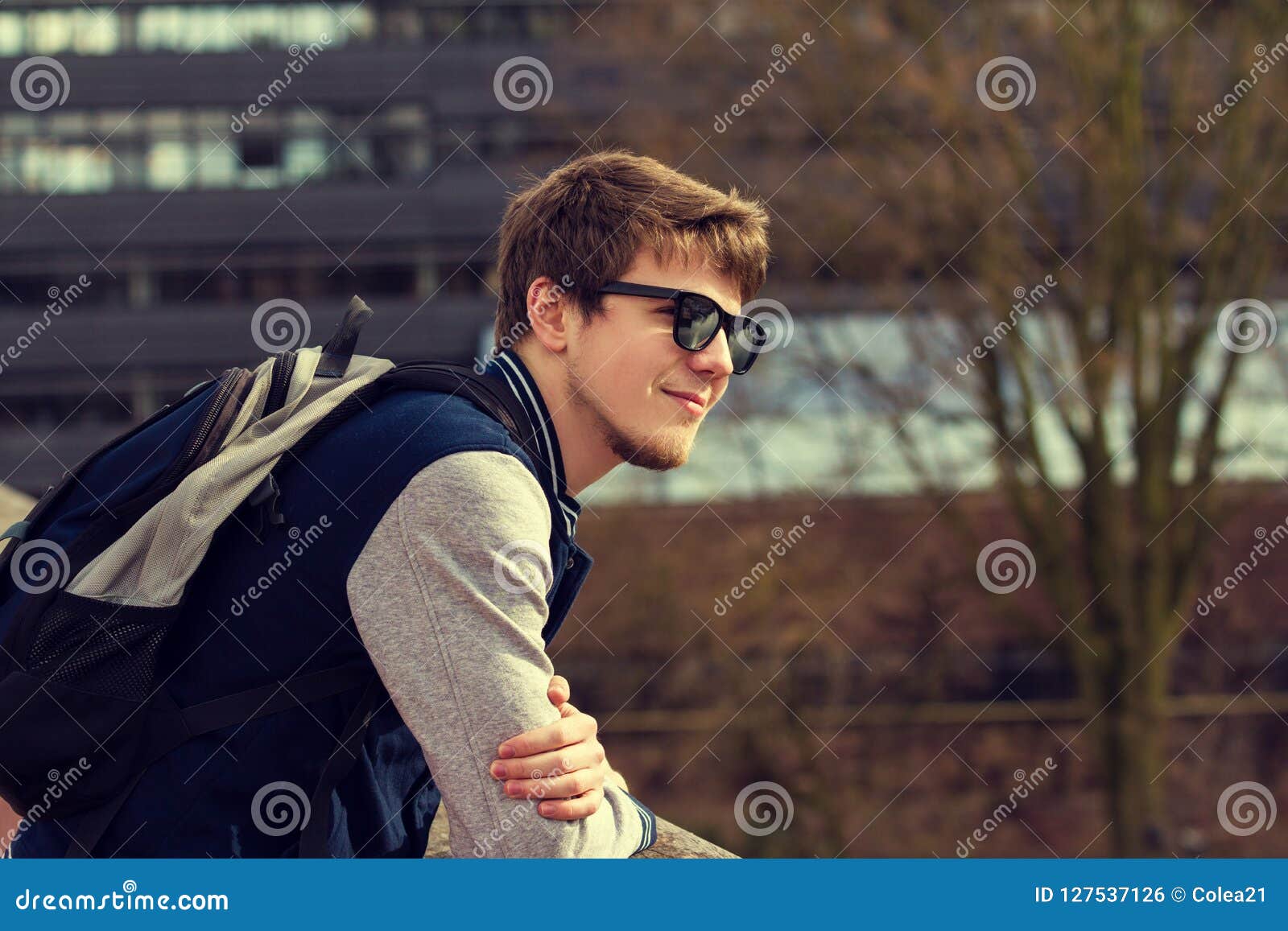 Smiling Young Student Relaxing Stock Photo - Image of handsome, call ...