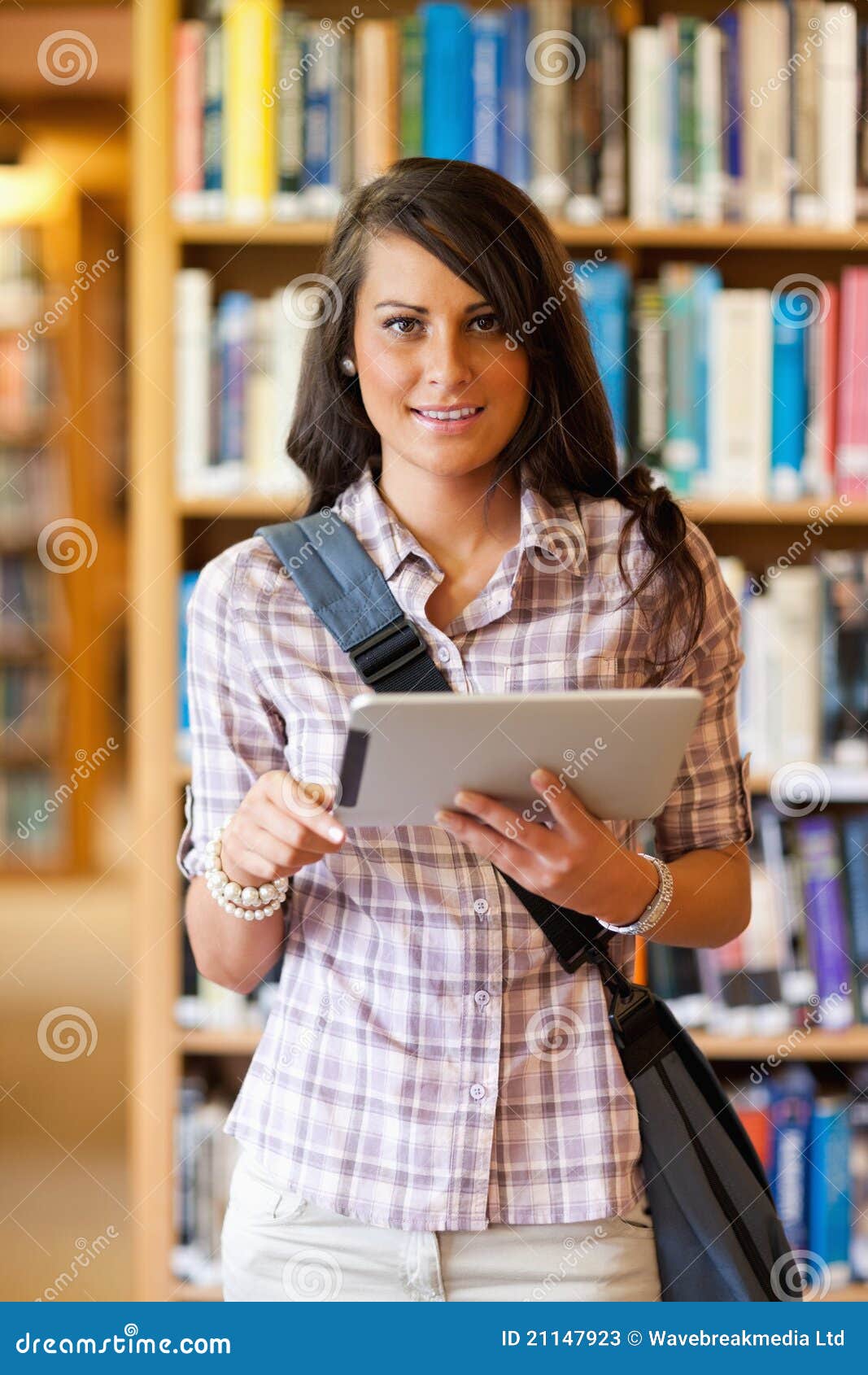 A Smiling Young Student Using a Tablet Computer Stock Image - Image of ...