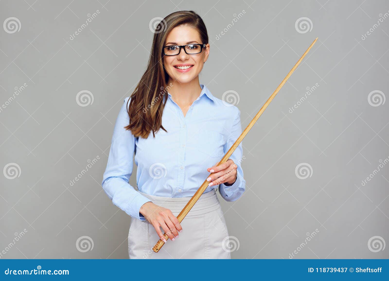 Smiling Young Teacher Pointing with Wand Stock Image - Image of single ...