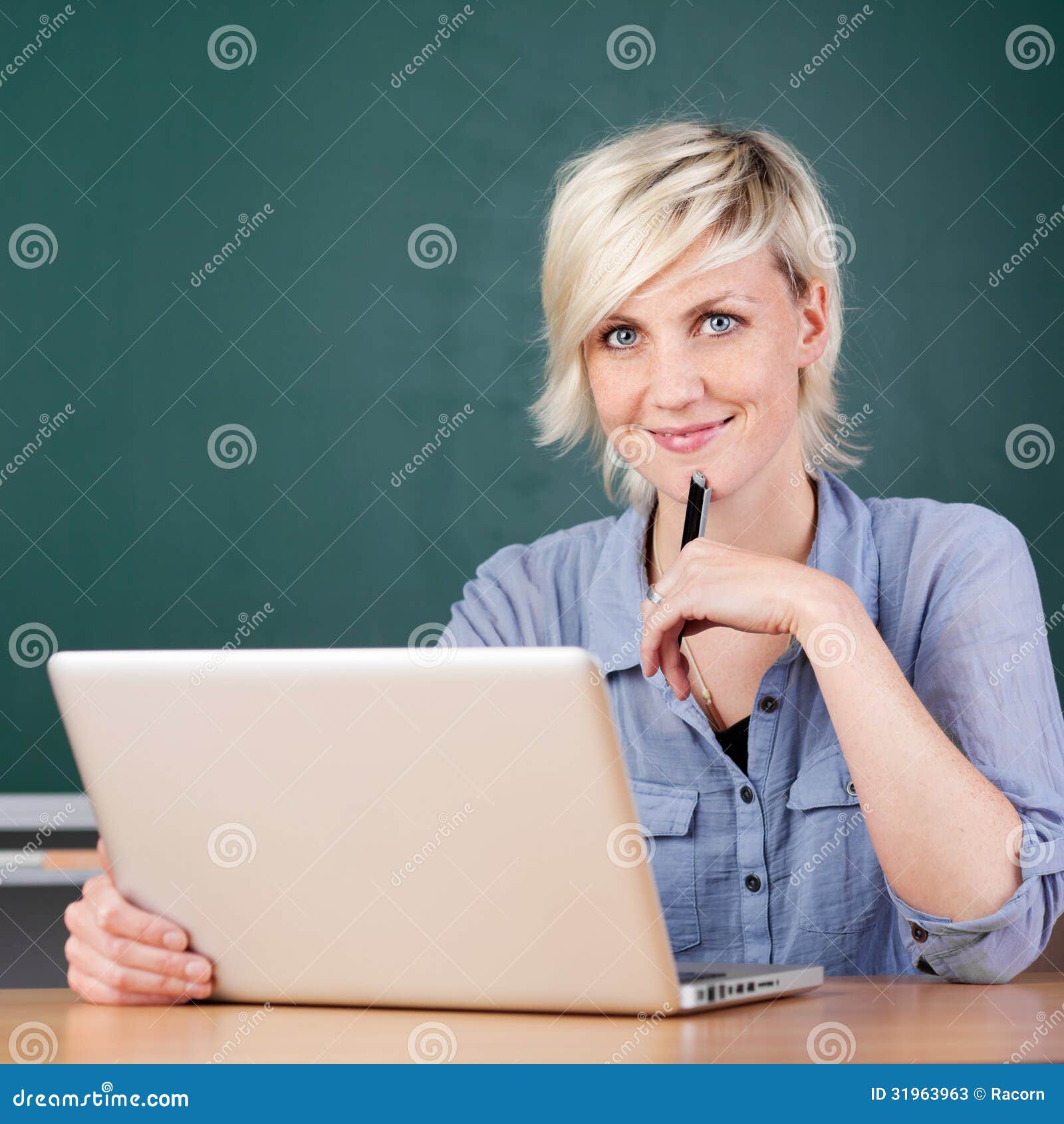 Smiling Young Teacher Using Laptop at School Stock Image - Image of ...