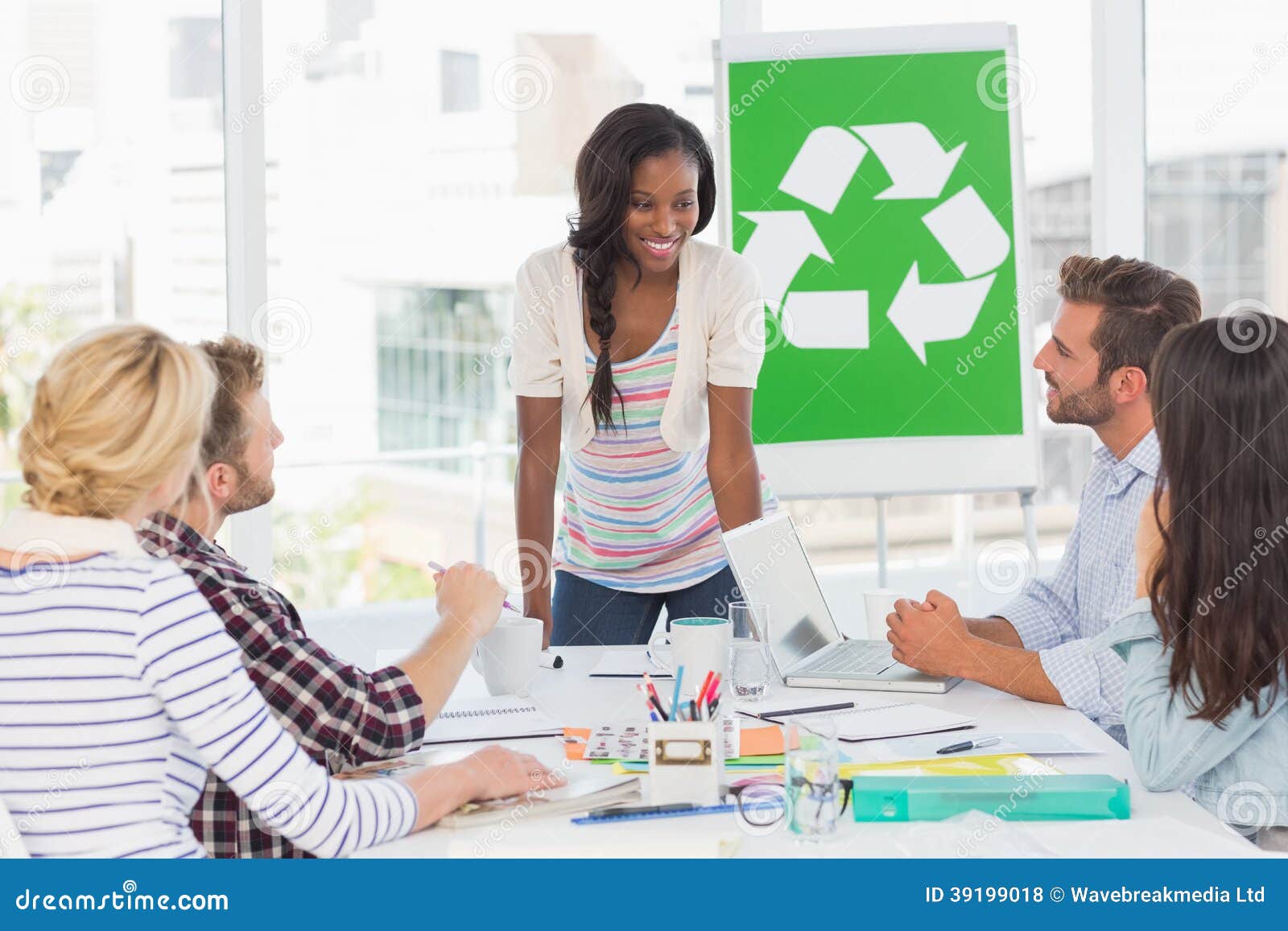 Smiling Young Team Having a Meeting about Recycling Policy Stock Photo ...