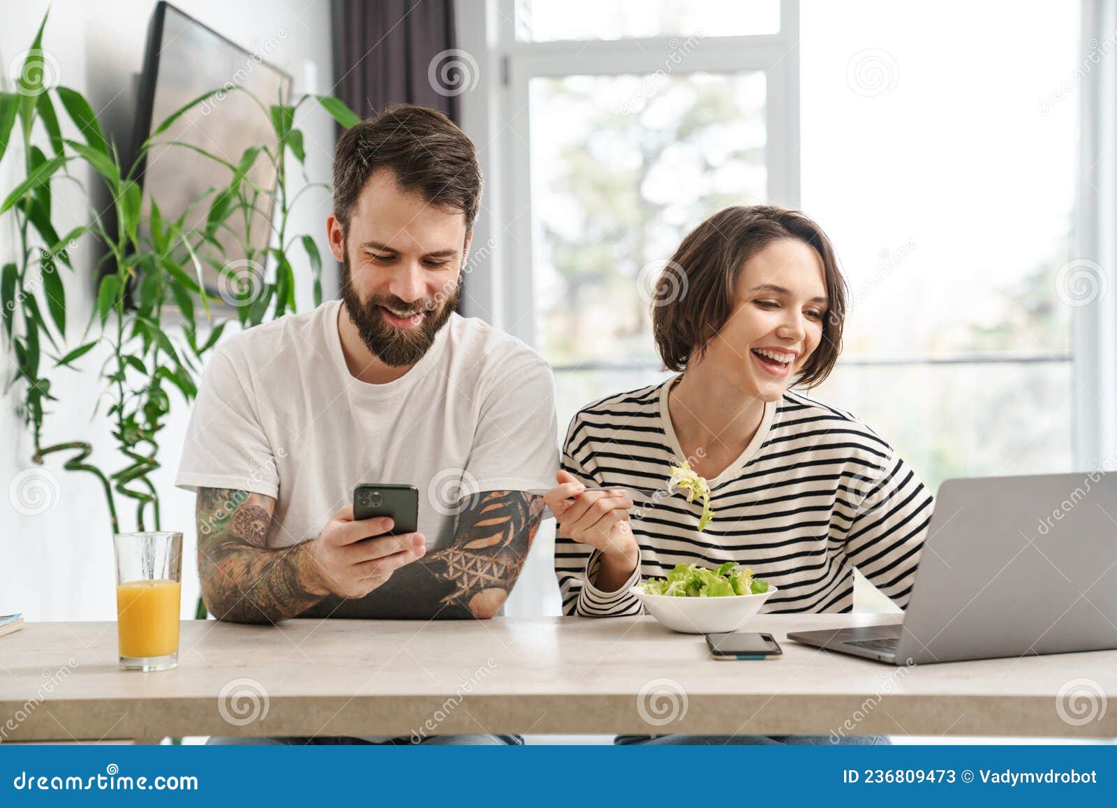 Smiling Young White Couple Sitting at the Table Stock Image - Image of ...