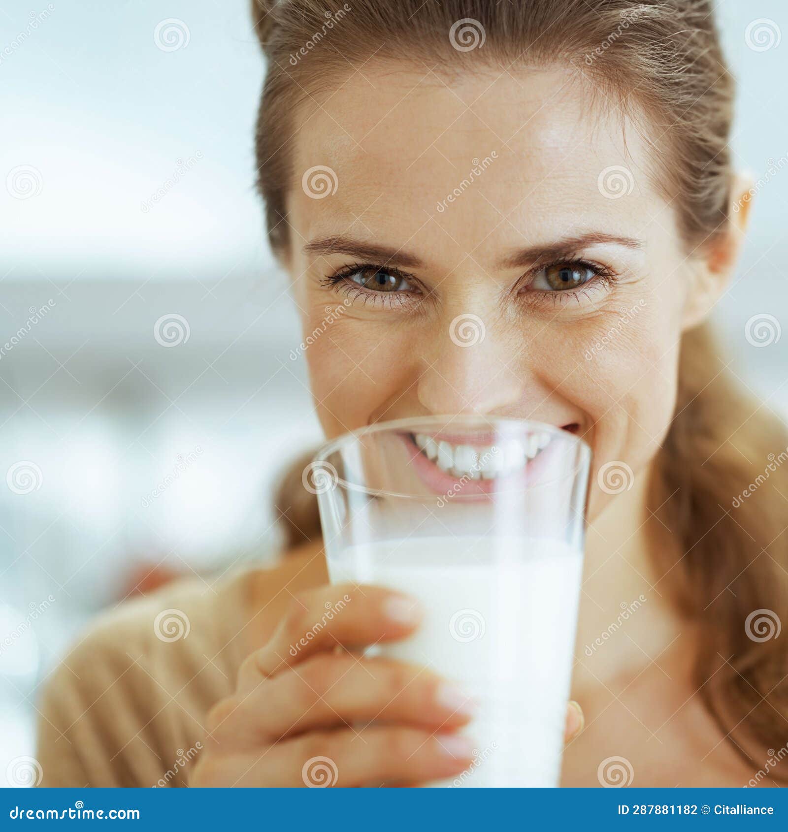 Smiling Young Woman Drinking Milk in Kitchen Stock Photo - Image of ...