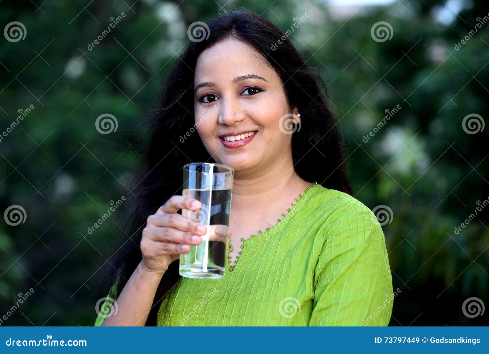 Smiling Young Woman Drinking Water at Outdoors Stock Image - Image of ...