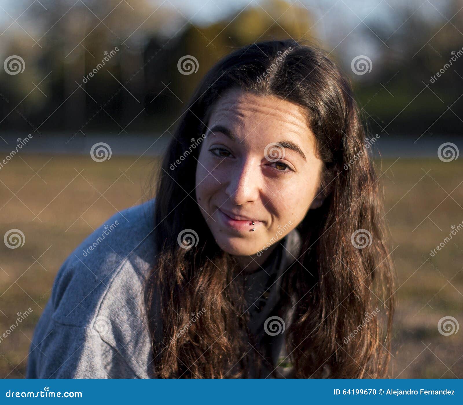 Smiling Young Woman at Dusk Stock Photo - Image of contrast, woman ...