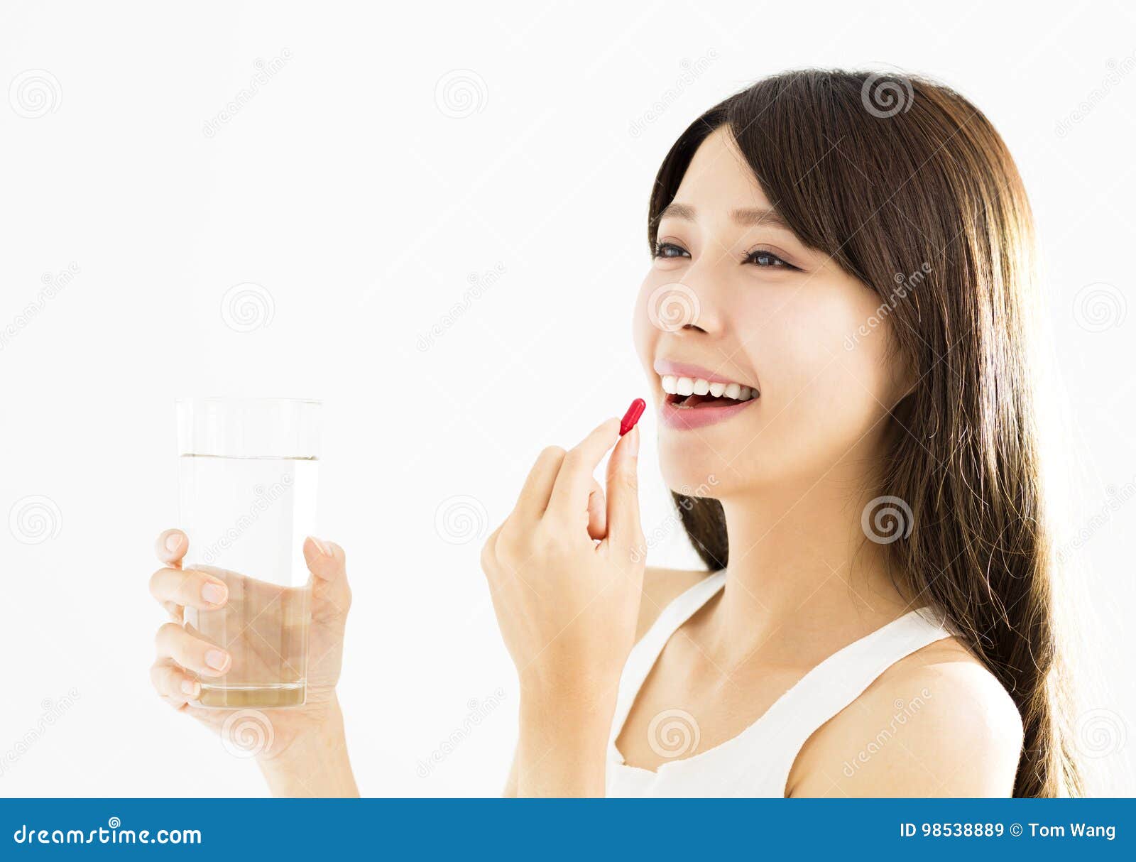 Smiling Young Woman Eating the Pill Stock Image - Image of face, girl ...