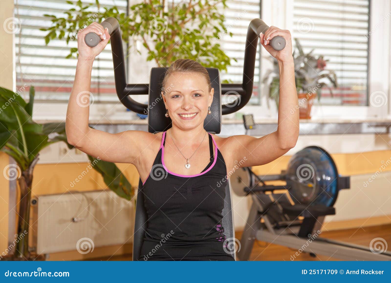 Smiling Young Woman Exercising in Gym Stock Image - Image of effort ...