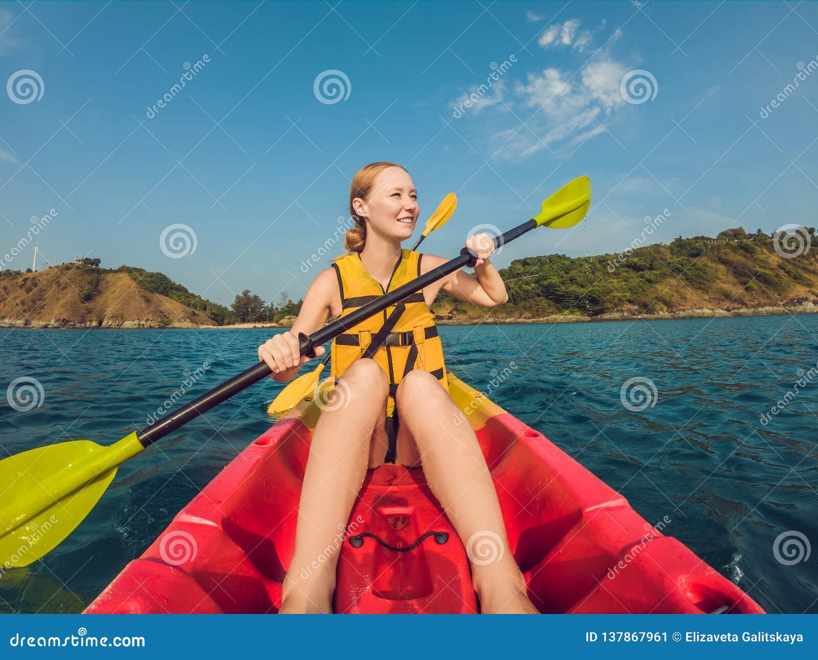 Smiling Young Woman Kayaking On Sea Happy Young Woman Canoeing In Sea