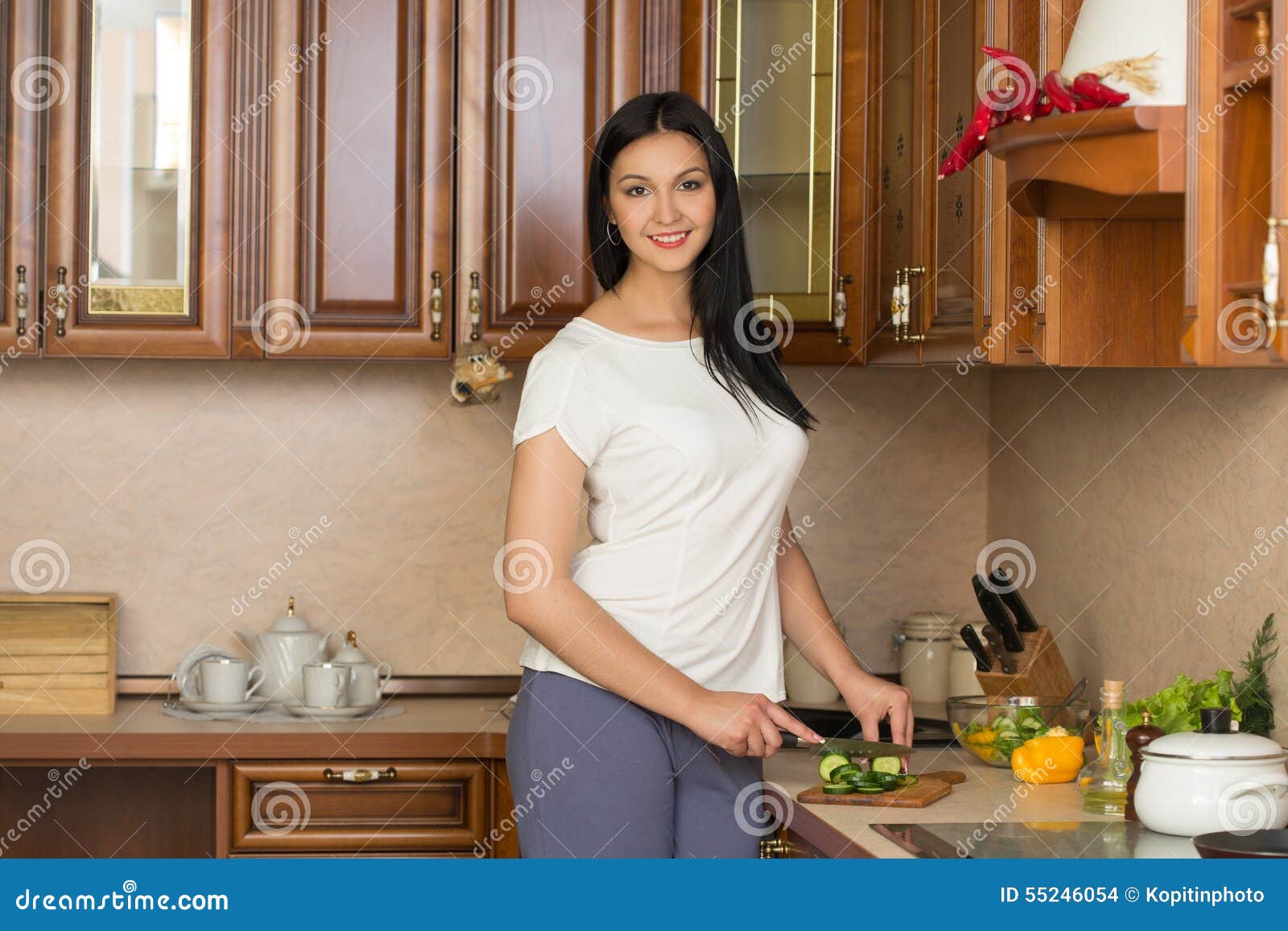 Smiling Young Woman in the Kitchen with Vegetables Stock Photo - Image ...