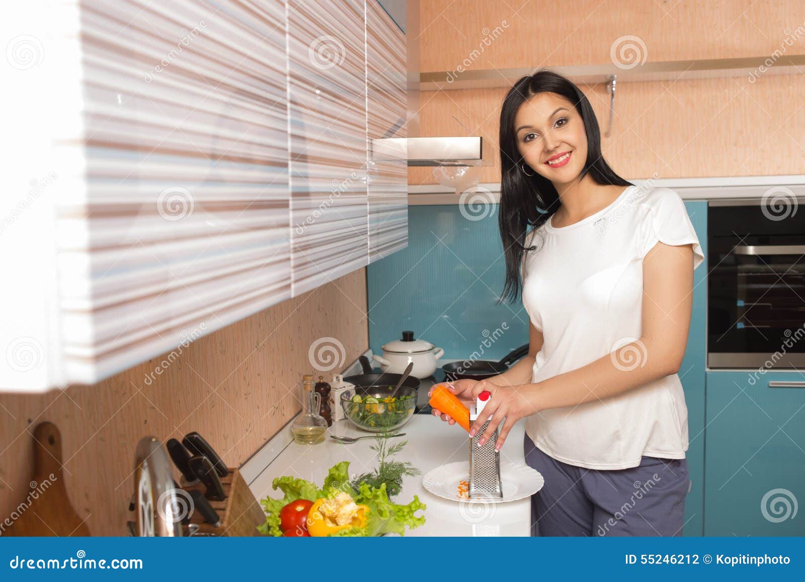 Smiling Young Woman in the Kitchen with Vegetables Stock Photo - Image ...