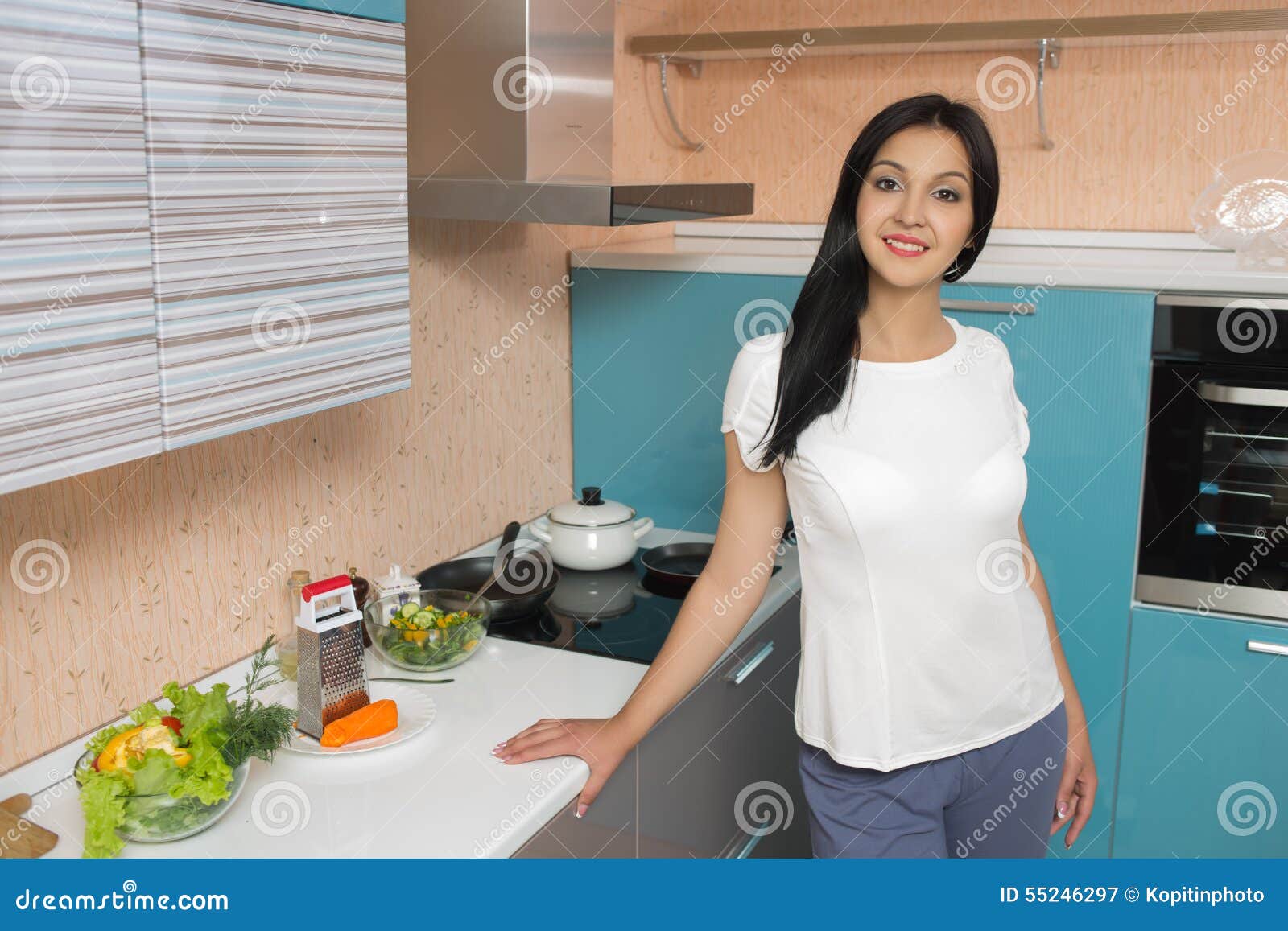 Smiling Young Woman in the Kitchen with Vegetables Stock Image - Image ...
