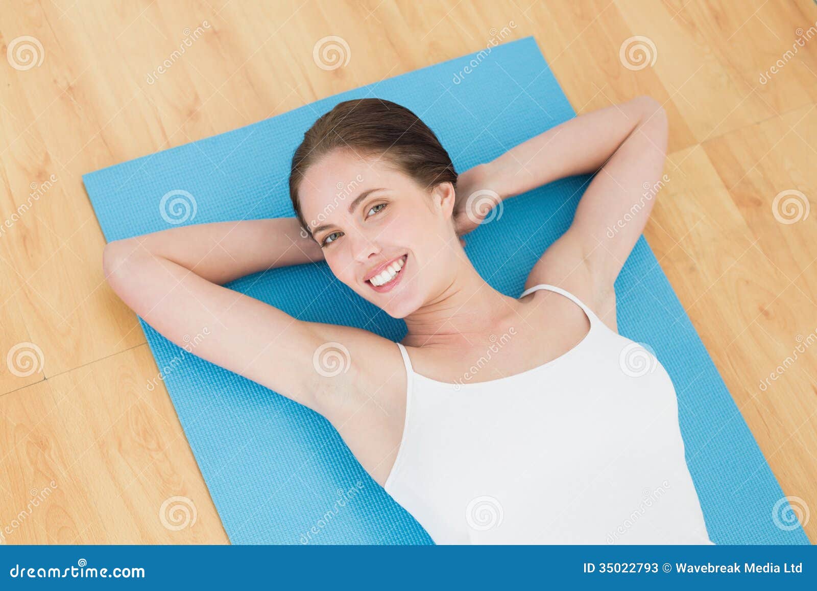 Smiling Young Woman Lying on Exercise Mat Stock Image - Image of body ...