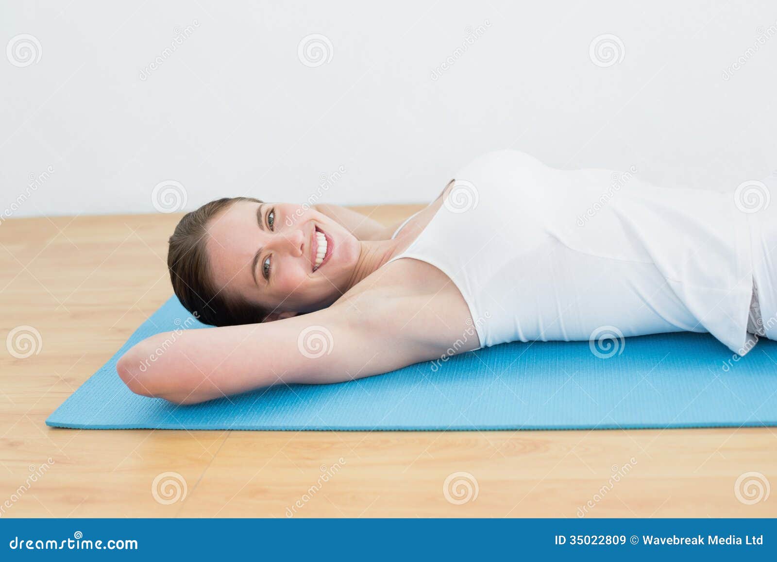 Smiling Young Woman Lying on Exercise Mat Stock Image - Image of ...