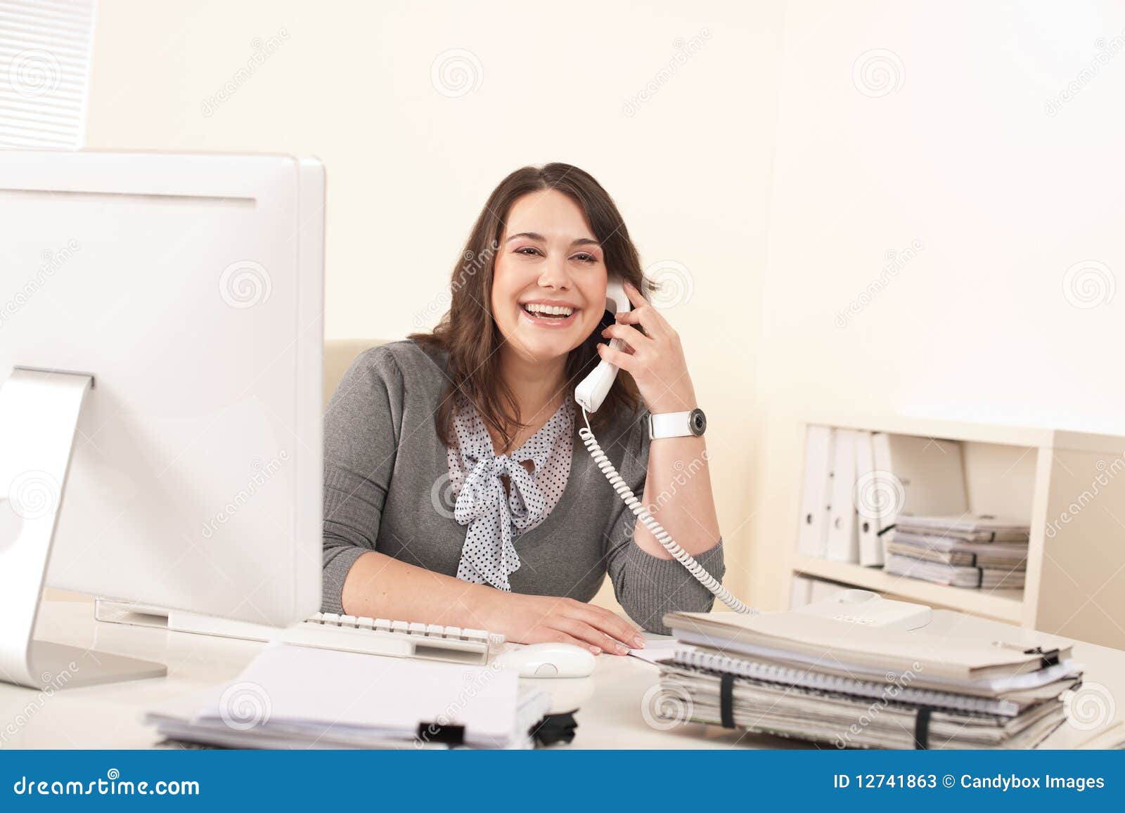 Smiling Young Woman on the Phone at Office Stock Image - Image of ...