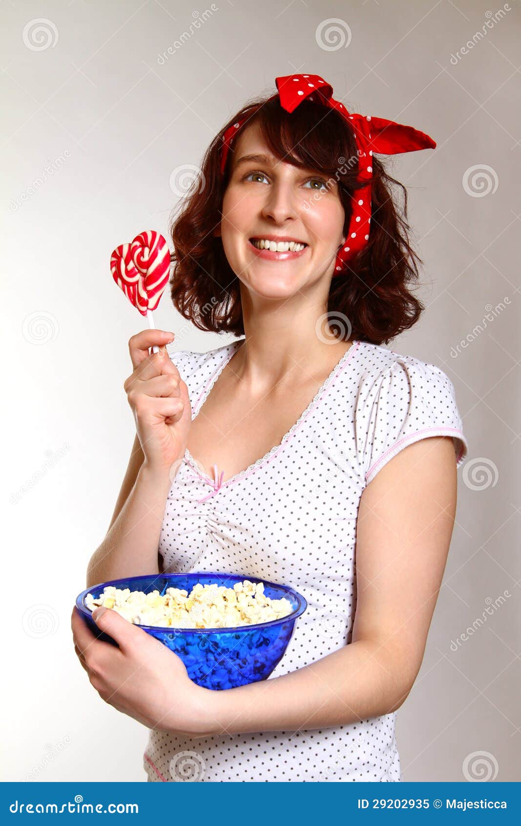 Smiling Young Woman with Popcorn and Lollipopg on a Gra Stock Image ...