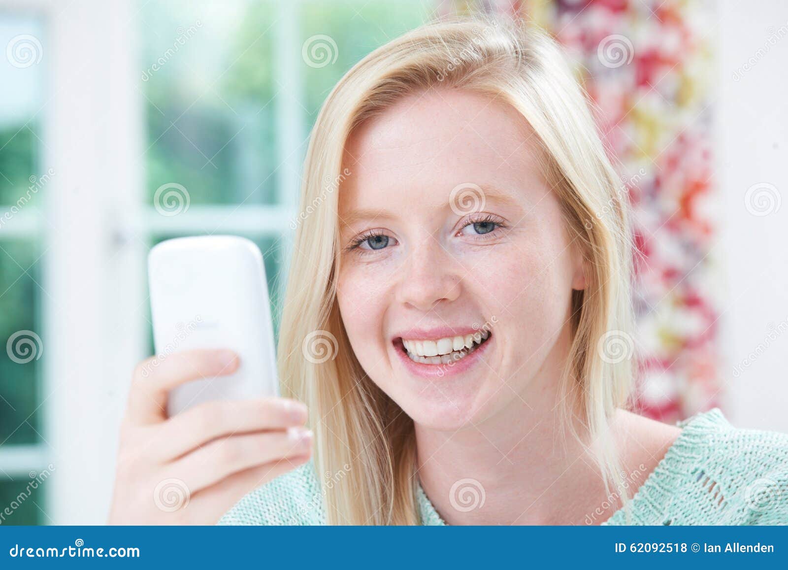 Smiling Young Woman Reading Text Message Stock Photo - Image of home ...
