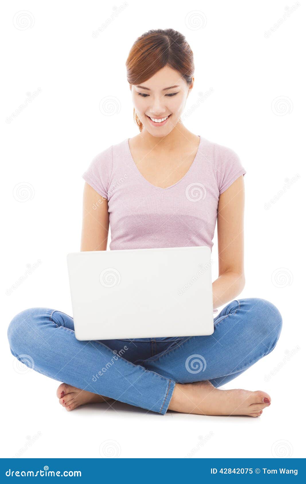 Smiling Young Woman Sitting and Using a Laptop Stock Image - Image of ...