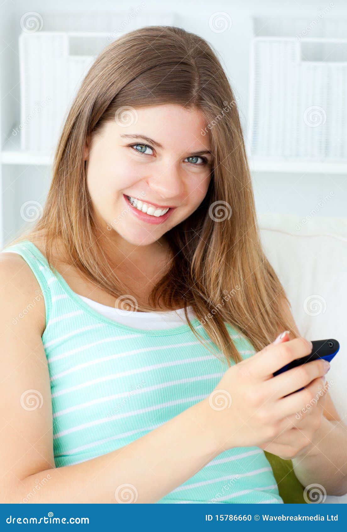 Smiling Young Woman Texting on Her Cellphone Stock Photo - Image of ... Smiling Young Woman Texting on Her Cellphone Stock Photo - Image of ...