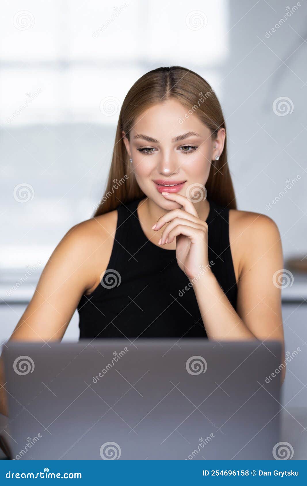 Smiling Young Woman Typing on Her Laptop at Kitchen Stock Photo - Image ...