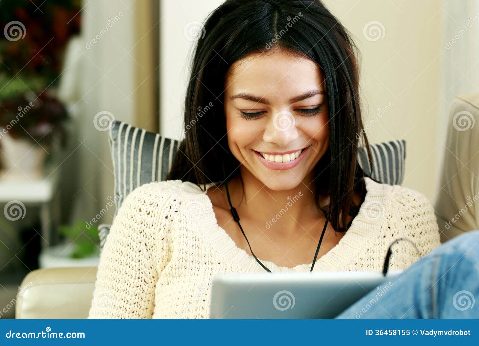Smiling Young Woman Using Tablet Computer at Home Stock Image - Image ...