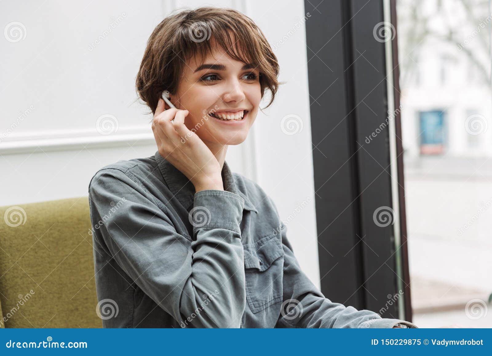 Smiling Young Woman Using Wireless Earphones Stock Image - Image of ...