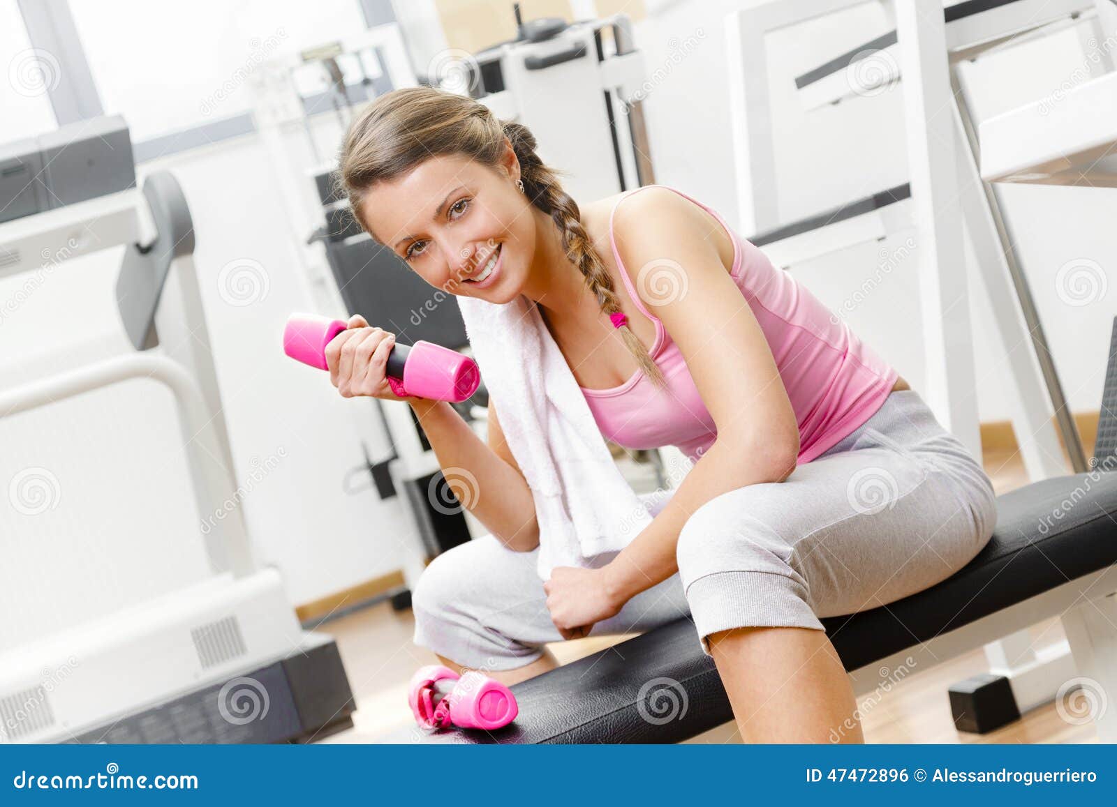 Smiling Young Woman Weightlifting on the Bench Stock Photo - Image of ...