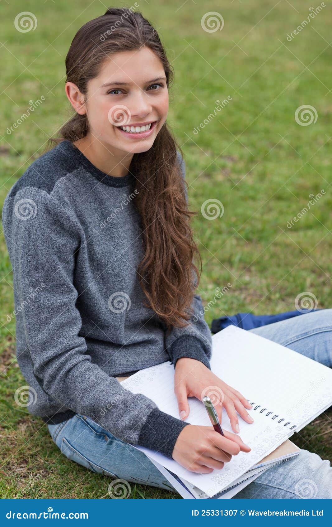 Smiling Young Woman Writing on Her Notebook Stock Image - Image of ...