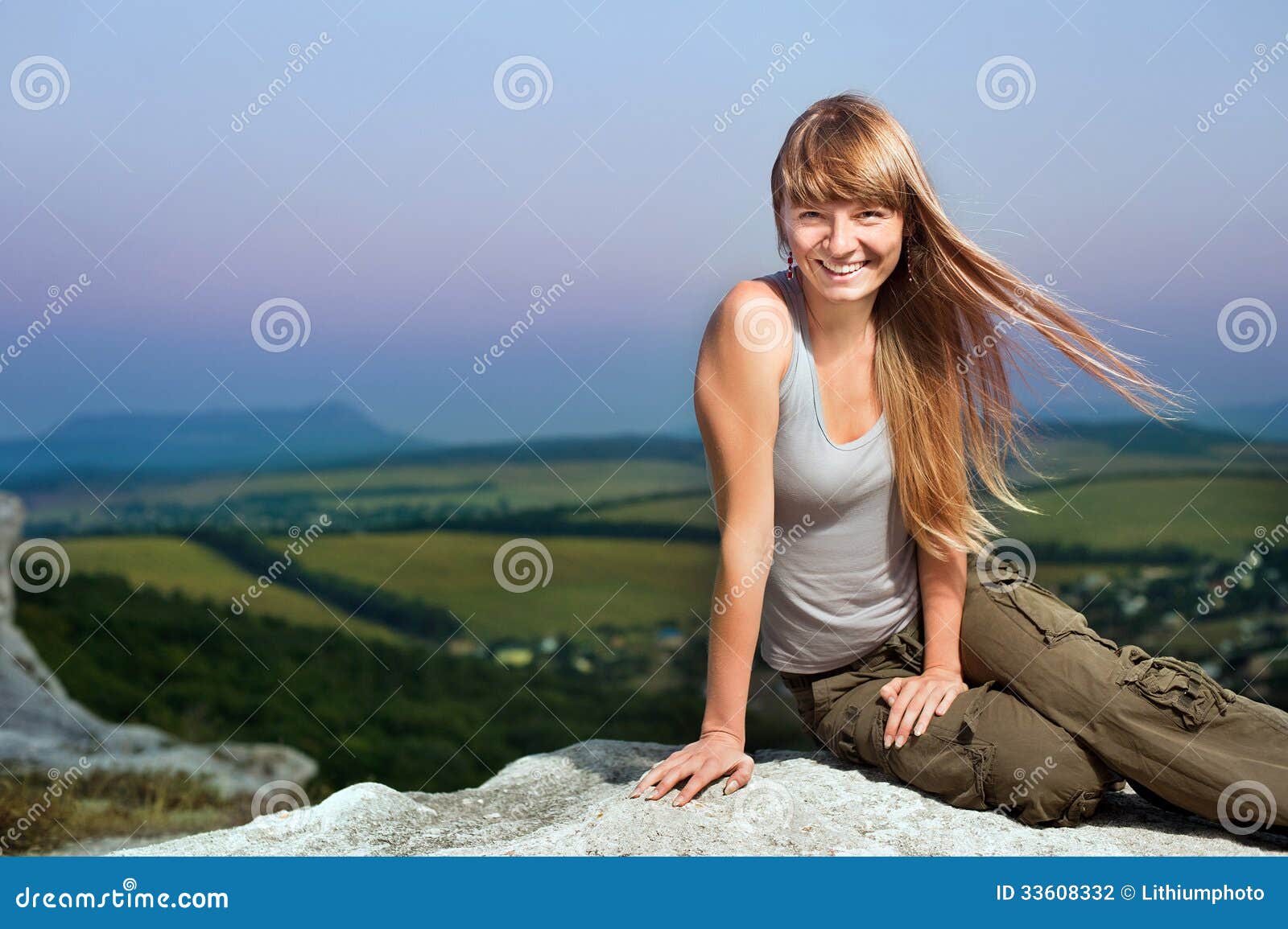 Smiling Young Womansitting on the of the Mountain Stock Photo - Image ...
