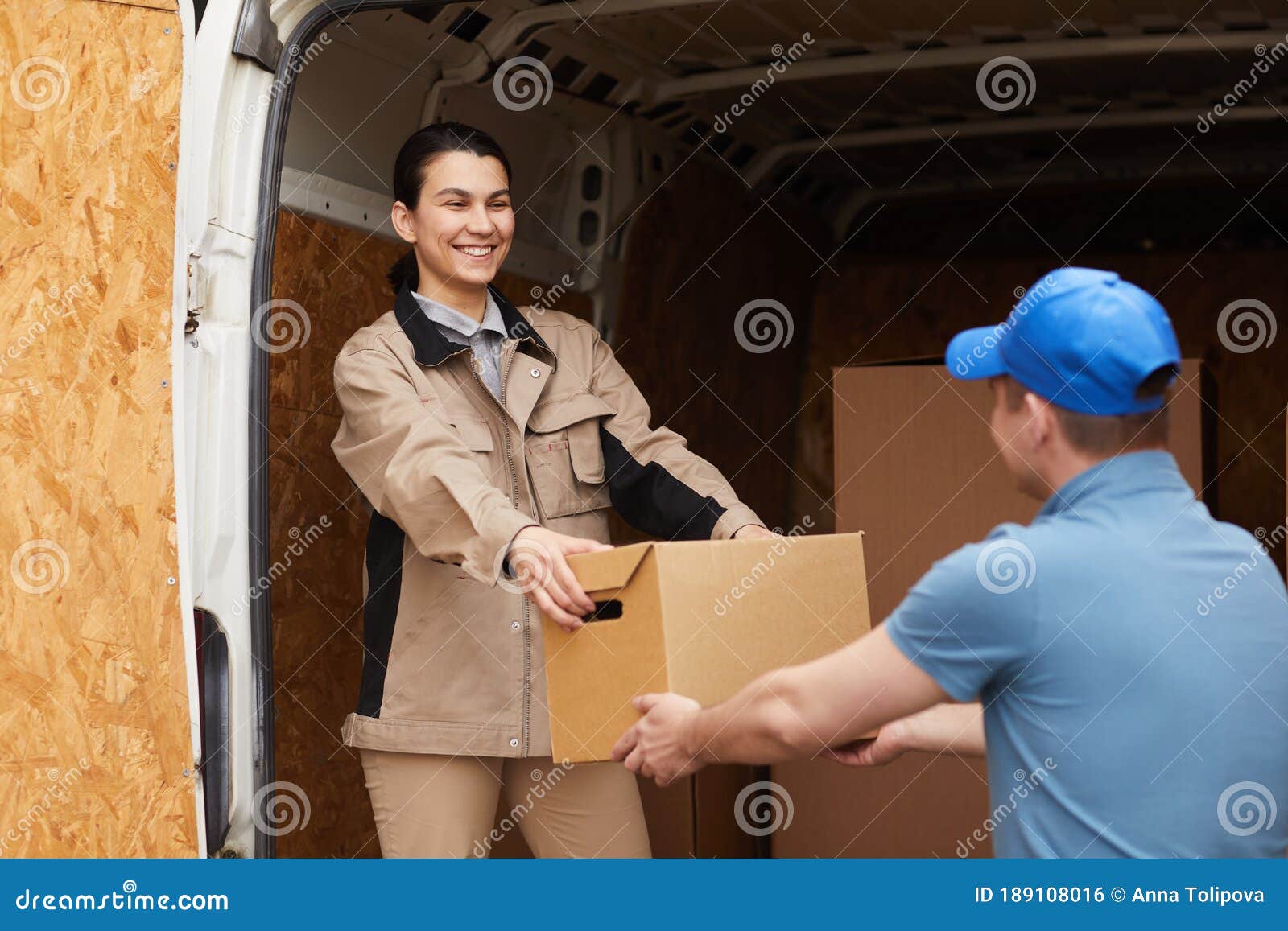 People unloading boxes stock photo. Image of service - 189108016