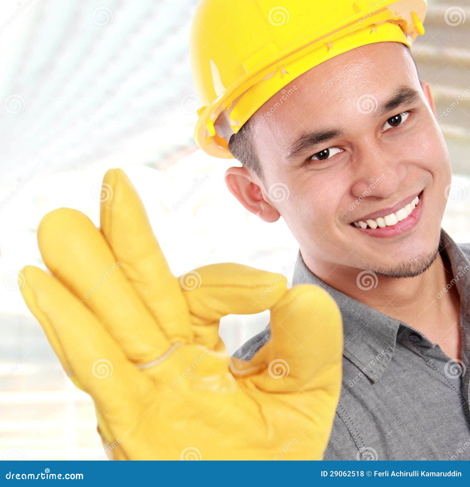 Smiling young worker stock photo. Image of gloves, industrial - 29062518