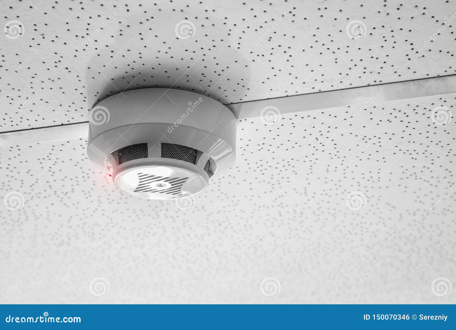 Smoke detector on ceiling stock photo. Image of building - 150070346