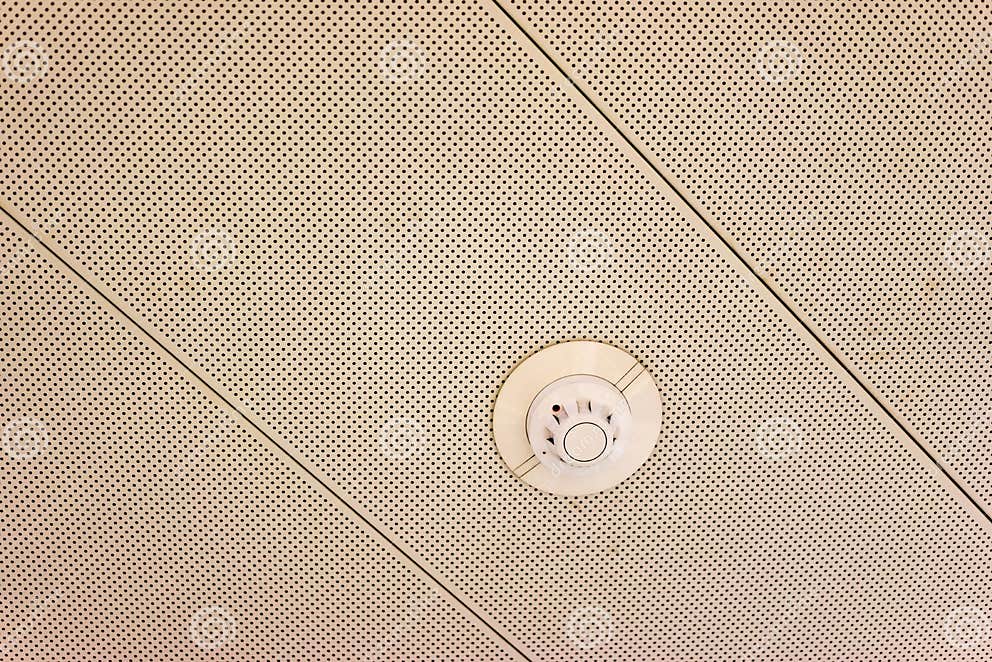Smoke Detector with Fire Alarm System on Dotted Ceiling Stock Image ...