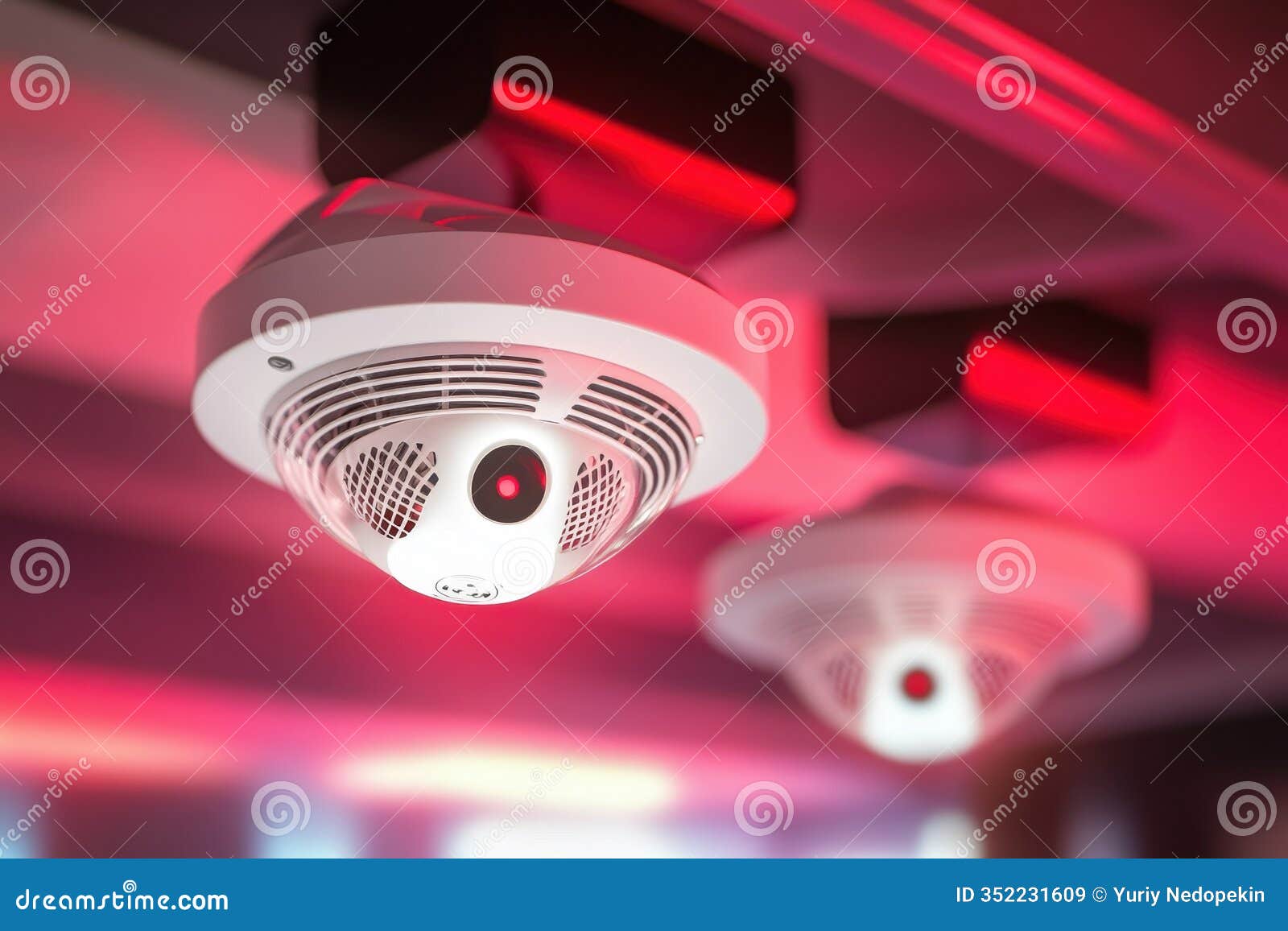 Ceiling Mounted Smoke Detectors with Red Indicator Lights in a Modern ...