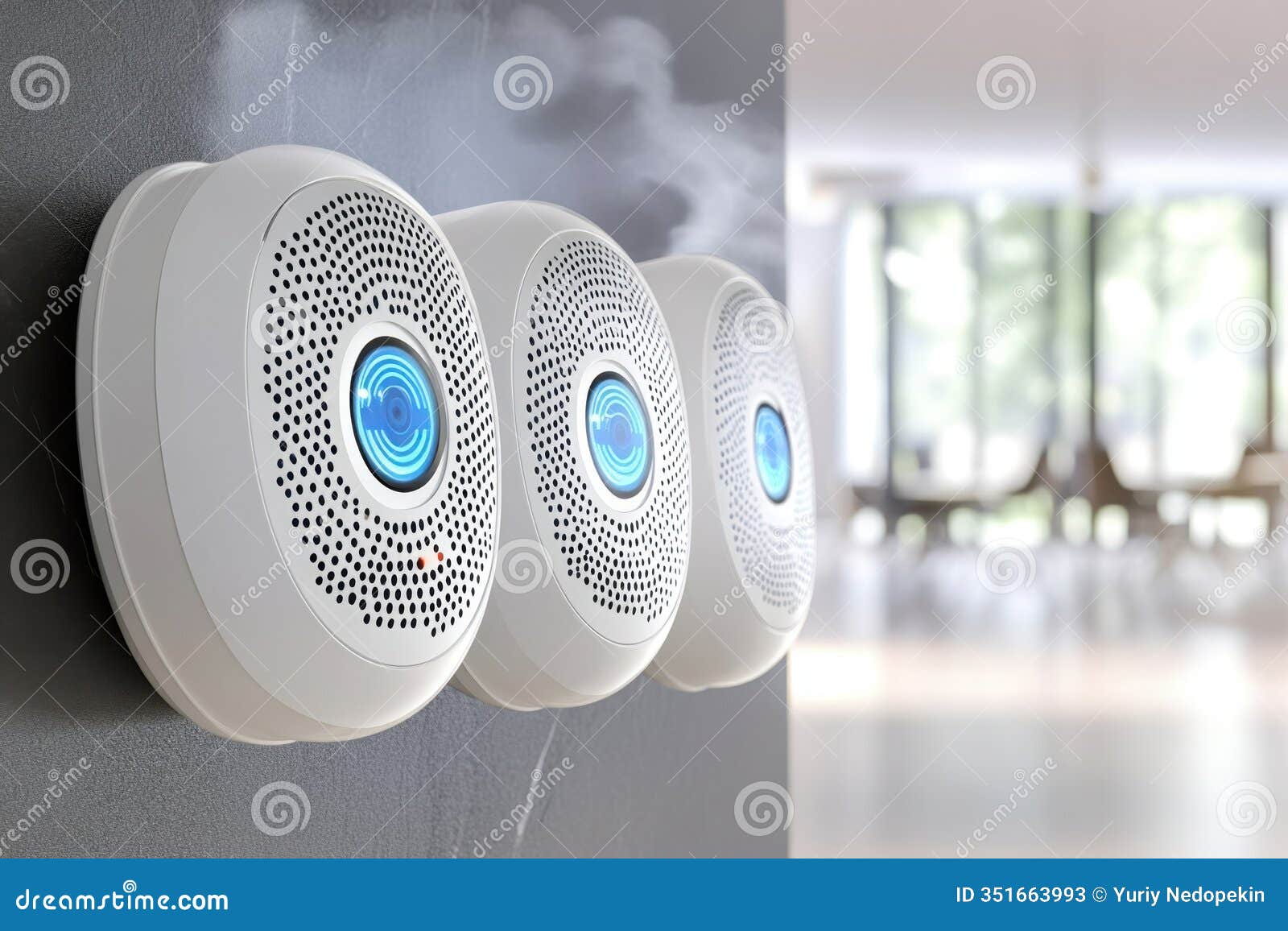 Smoke Detectors Mounted on a Wall in a Modern Indoor Space with Visible ...