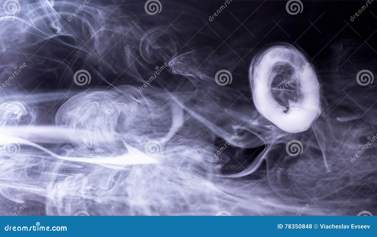 Smoke ring stock photo. Image of dust, isolated, dark - 78350848
