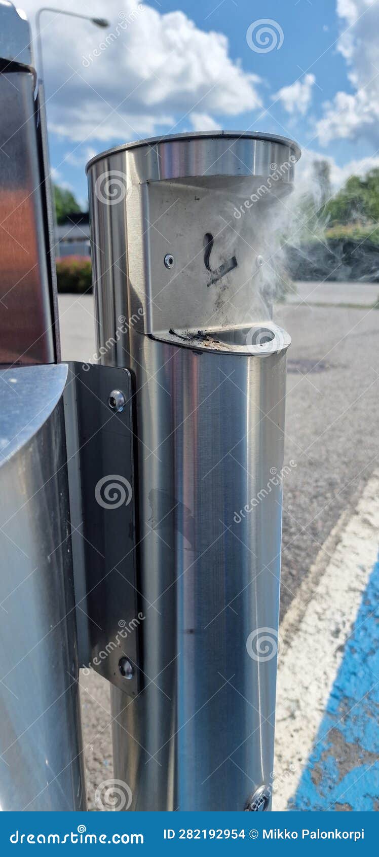 Smoke Rising from Inside Metal Cigarette Disposal Bin Caught on Fire ...