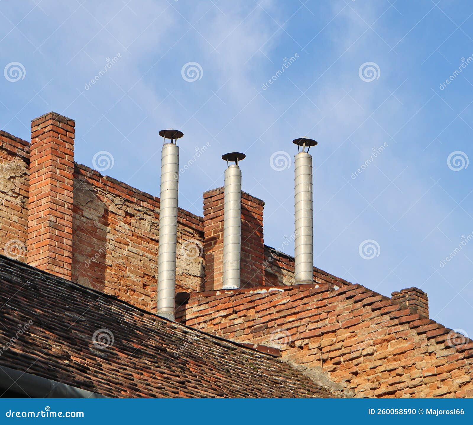 Smoke Stacks on the Roof of a House Stock Photo - Image of metal ...