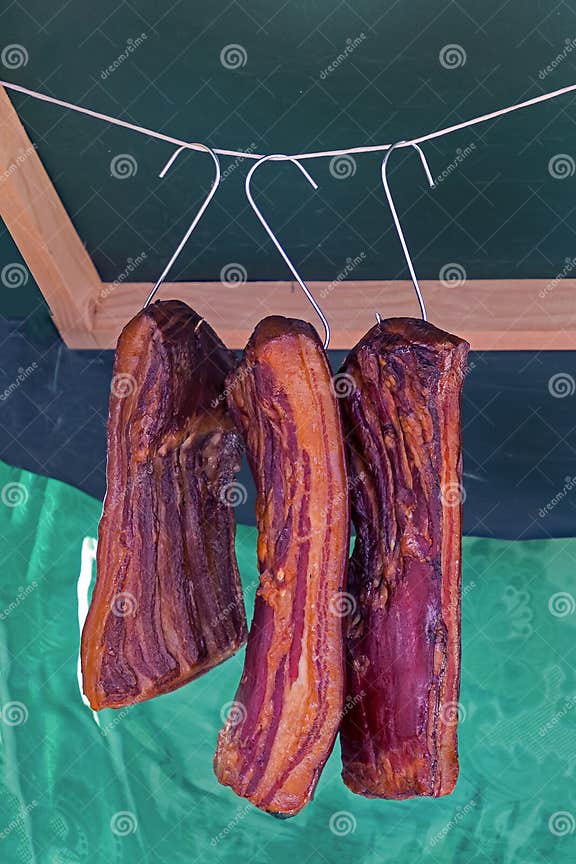 Smoked Bacon Hanging on a String Stock Photo - Image of bacon, cured ...