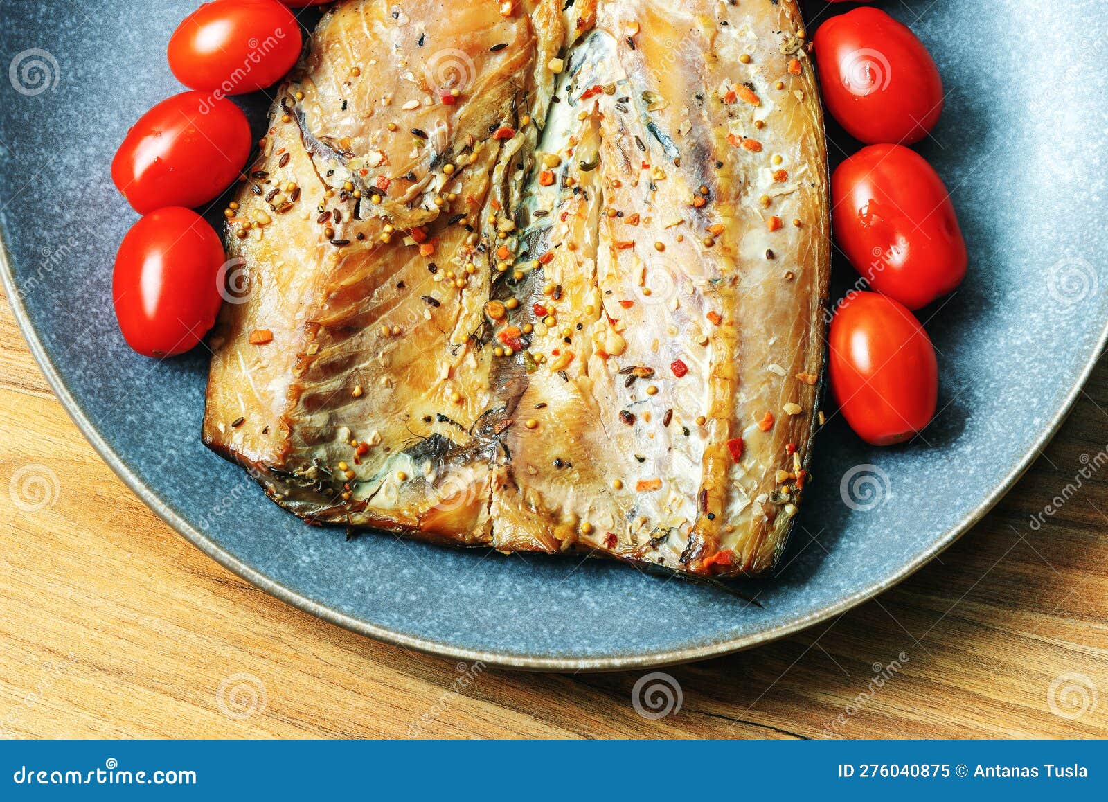 Smoked Mackerel Fish Fillet with Mini Tomatoes on a Plate Stock Image ...