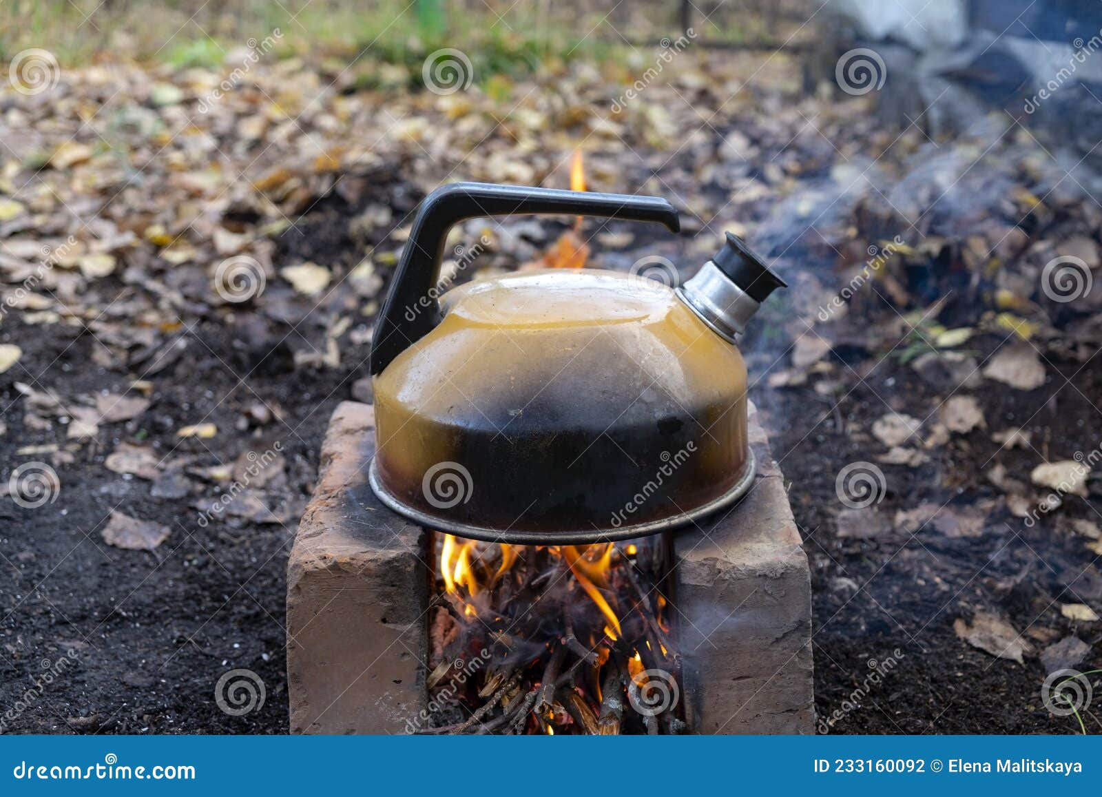 Smoked Metal Kettle Boils on Fire on Bricks Outdoors Stock Photo ...