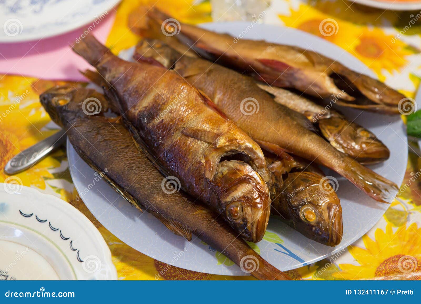 Smoked perch on a plate. stock image. Image of plate - 132411167