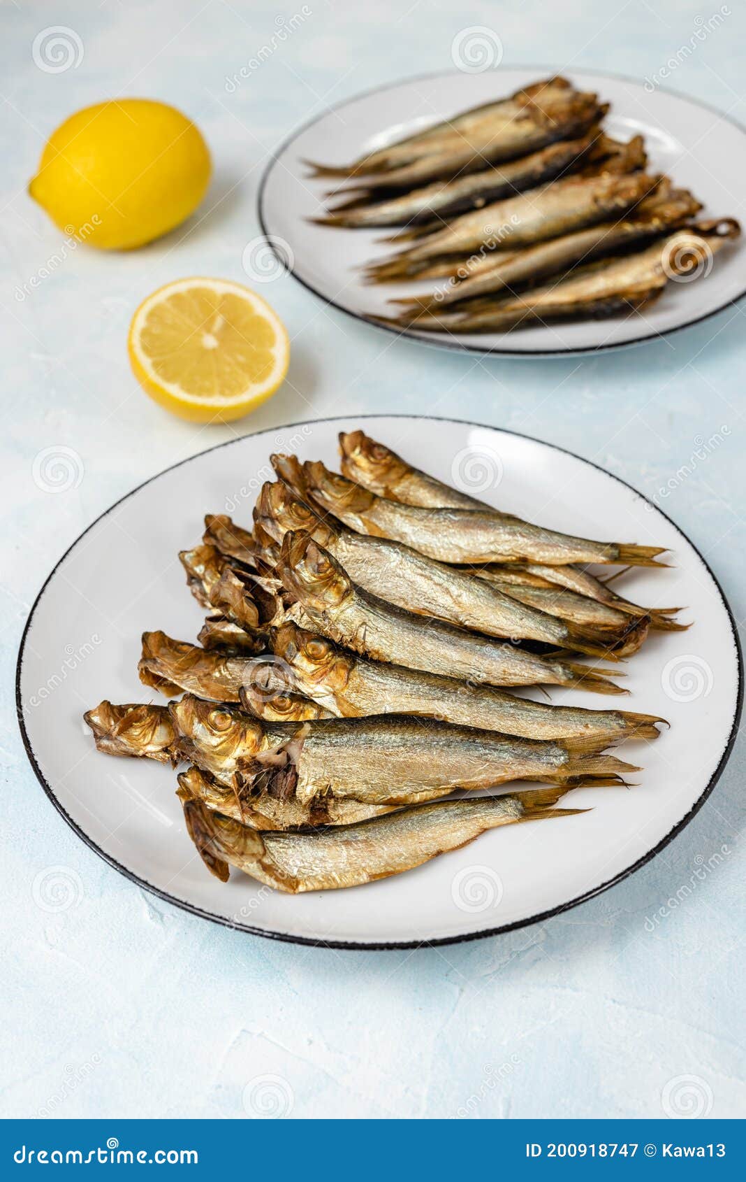 Smoked sprats on a plate stock image. Image of white - 200918747